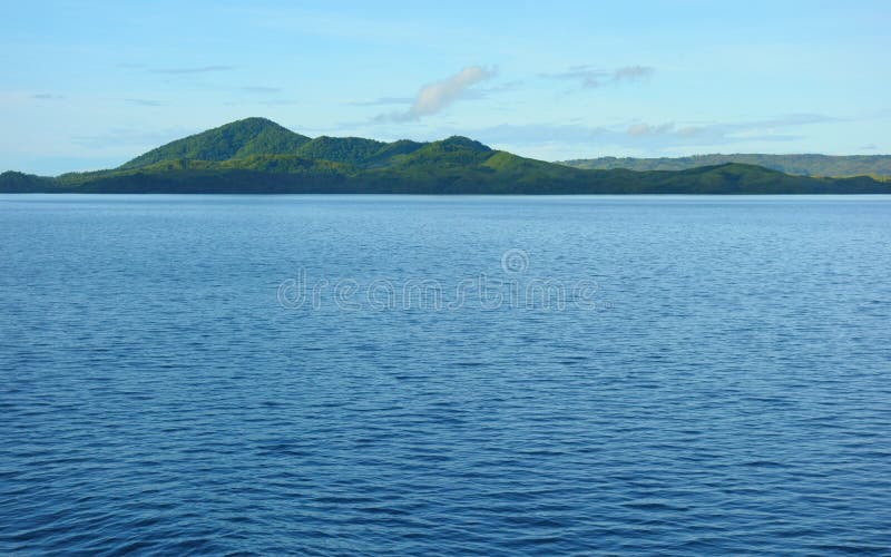 Island on the horizon stock photo. Image of pacific - 103881650