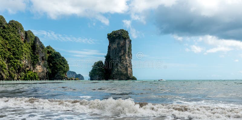 Island with Waves Breaking on Beach in the Foreground Stock Image ...