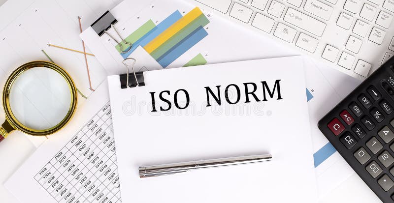 ISO NORM Text on the White Paper on the Light Background with Charts ...