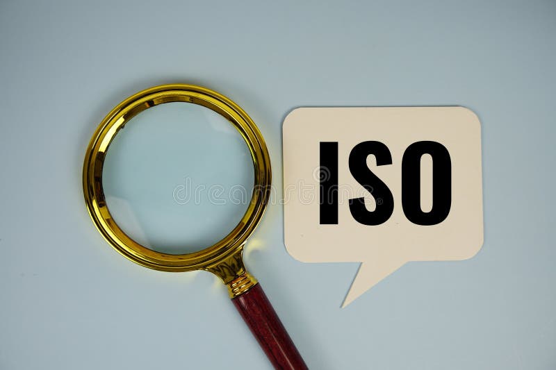 ISO Text on Speech Bubble with Magnifying Glass Top View on Blue ...