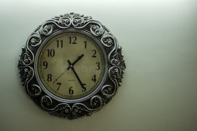 Ancient Designer Wall Clock with Light Yellow Back Ground Showing Time ...