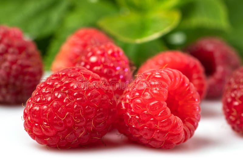 Isolated Berries. Pile of Raspberry Fruits with Leaves Isolated on ...