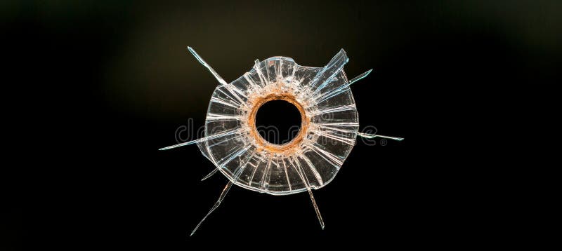 Isolated Bullet Hole in Glass with Spiderweb Cracks, Dramatic Contrast ...