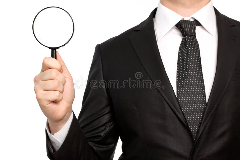Isolated Businessman in a Suit Holding a Magnifying Glass Stock Photo ...