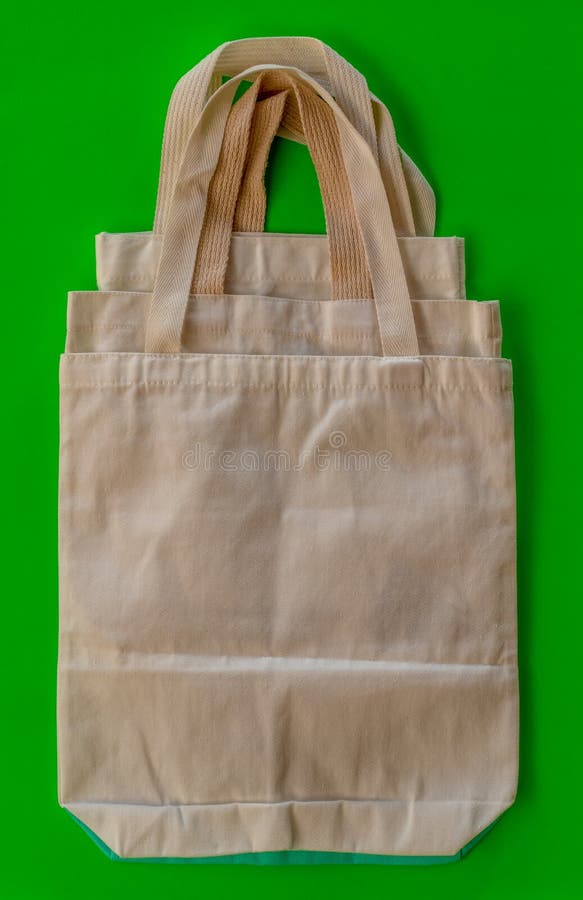 Isolated Calico Bags on a Green Backdrop Stock Photo - Image of fashion ...