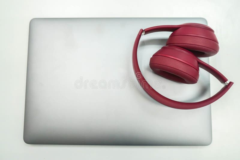 Isolated Cute Women Pink Wireless Headphone on Notebook Computer in ...