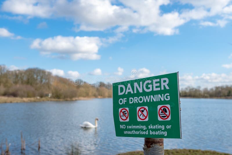 Isolated Image of a Danger Sign Seen Positioned Near a Deep, Open River ...