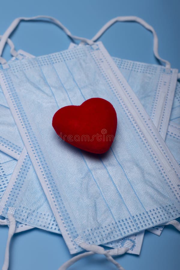 Isolated Image of Face Masks with a Red Heart. Valentine Concept Stock ...
