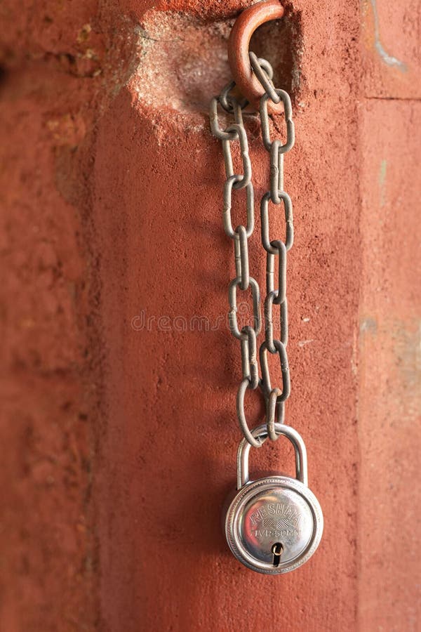Isolated Image of a Shiny Silver Padlock and Chain Hanging from an ...