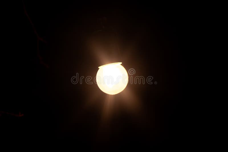 Isolated Light Bulb at Night Stock Image - Image of lighting, bulb ...