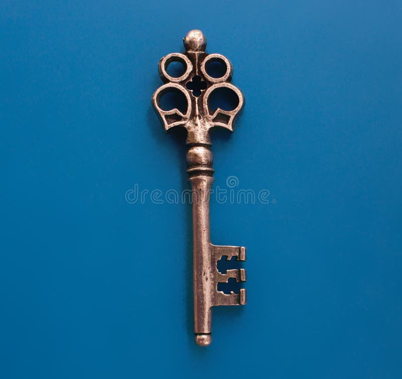 Isolated Metal Old Key On The Blue Background Stock Photo - Image of ...