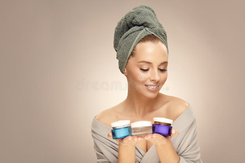Pretty Woman With Clean Fresh Skin Hold A Different Of Face Care Creams