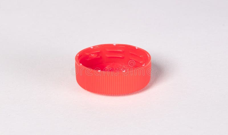 Isolated Red Plastic Cap - Concept of Pollution Stock Photo - Image of ...