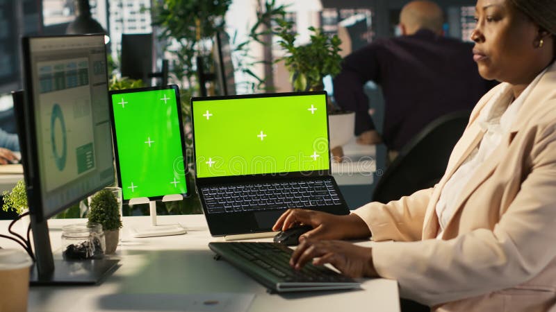 Isolated Screen Devices on Office Desk Next To Employee Editing ...