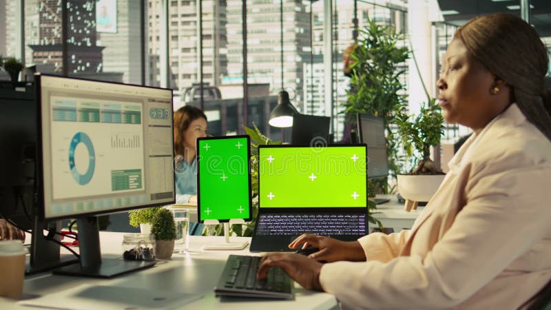 Isolated Screen Devices on Office Desk Next To Employee Editing ...