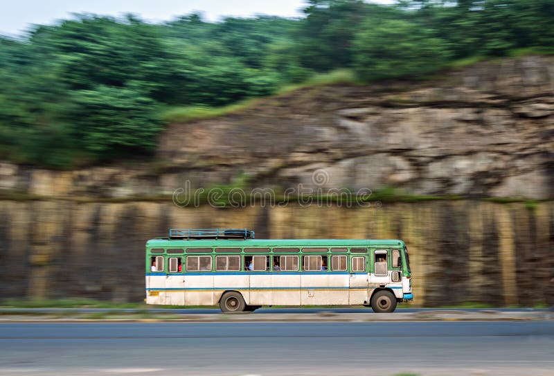 Isolated , Slow Shutter Speed Panning Image of a Speeding Bus on ...