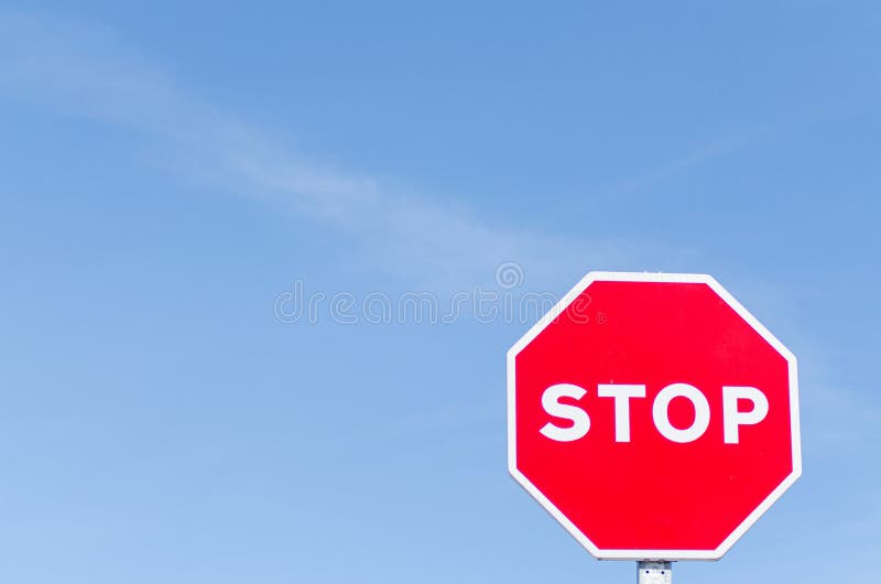 Isolated Stop Signal with Blue Sky Background Stock Photo - Image of ...