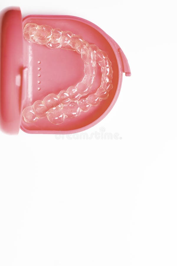 Isolated Transparent Teeth Prosthesis Aligner with Its Box and Blue Bow ...