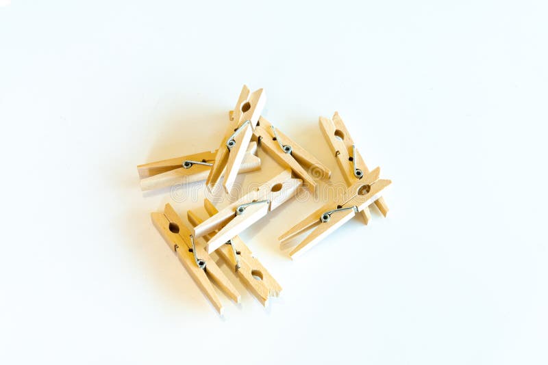 Isolated View of Several Wooden Clothes Pins on a White Background ...