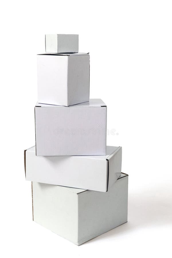 White Carton Boxes of Different Size Standing on Each Other As a High ...