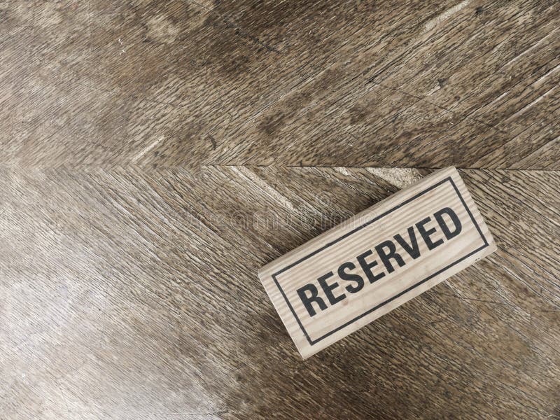 The Isolated Wording of Reserved on the Wooden Background Stock Image ...