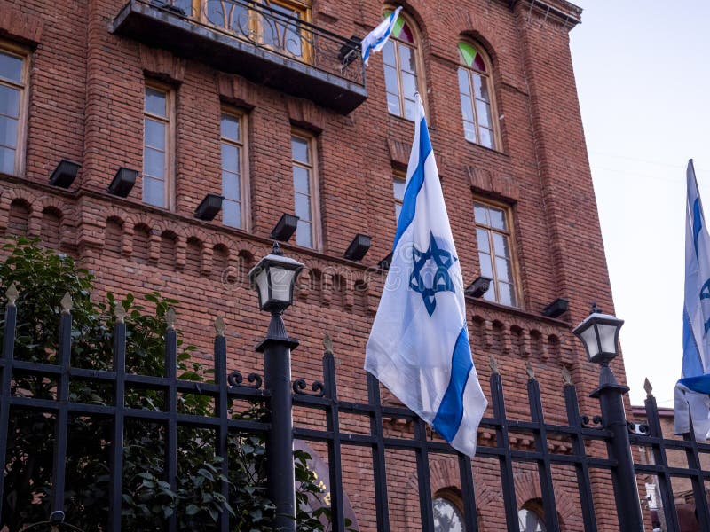 Israel Flag Set Next To a Red Brick Building Editorial Image - Image of ...
