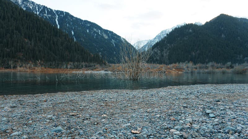 Issyk Mountain Lake with Mirror Water at Sunset. Stock Image - Image of ... Issyk Mountain Lake with Mirror Water at Sunset. Stock Image - Image of ...