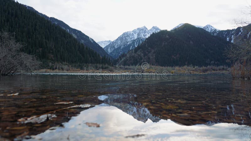 Issyk Mountain Lake with Mirror Water at Sunset. Stock Photo - Image of ... Issyk Mountain Lake with Mirror Water at Sunset. Stock Photo - Image of ...