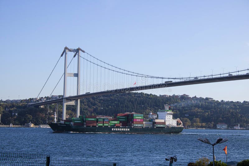 Container Carrier Ship Passing through the Bosphorus Bridge. Editorial ...