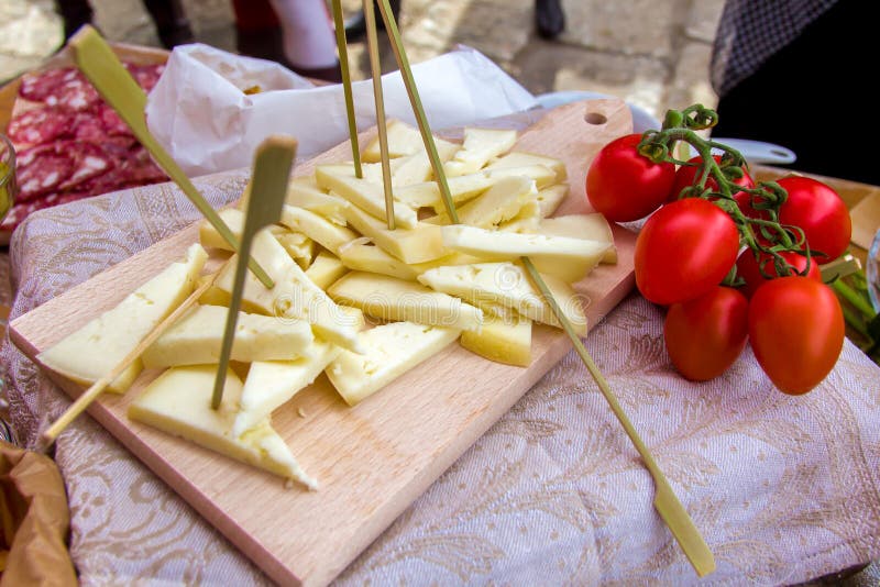 Italian Appetizer: Sliced Cheese on a Chopping Board Stock Photo ...
