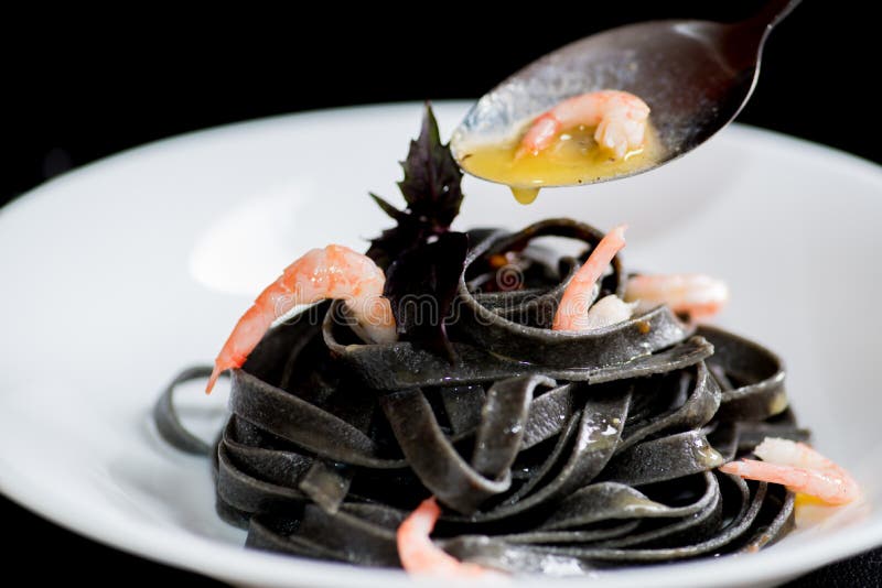 Italian Black Pasta with Red Tomato Sauce Stock Photo - Image of ...