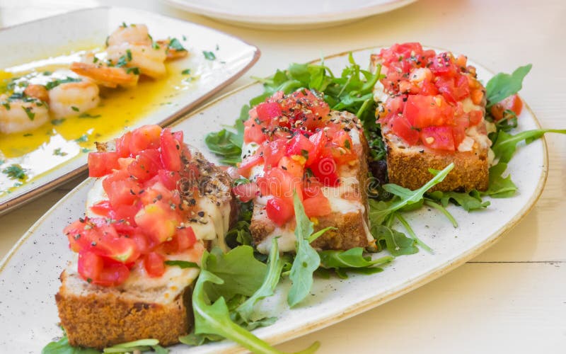 Italian Bruchetta with Fresh Tomato and Rocket Salad Stock Image ...