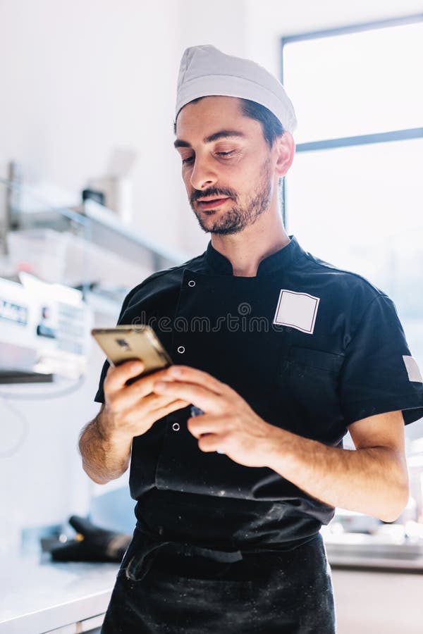 Italian Chef with Mobile Phone in Restaurant Kitchen Stock Image ...
