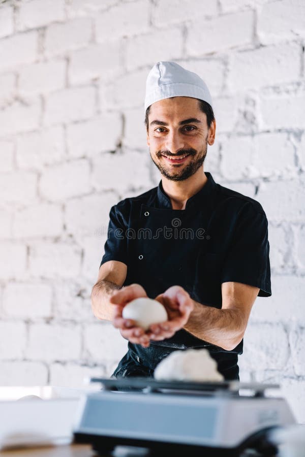 Italian Chef Pizzaiolo Preparing Pizza Dough in Restaurant Kitchen ...