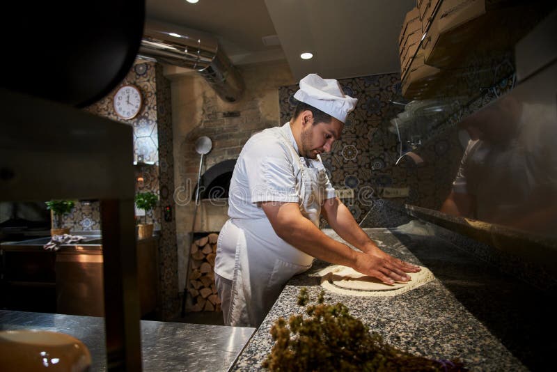 Chef is Making Pizza at the Restaurant Kitchen Stock Photo - Image of ...