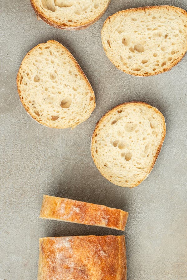 Italian Ciabatta Bread Cut in Slices on a Light Background. Vertical ...