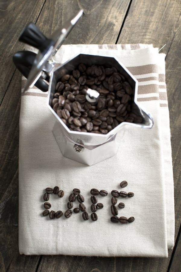 Italian Coffee Maker Pot Filled with Coffee Beans Stock Photo - Image ...