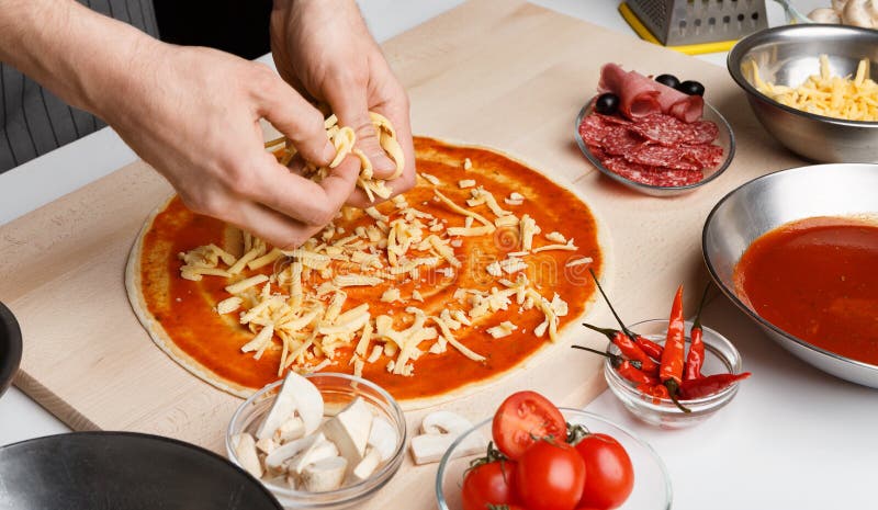 Italian Dish. Chef Adding Grated Cheese To Pizza Stock Image - Image of ...