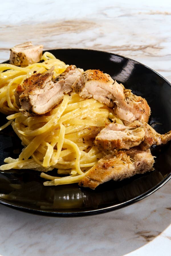 Italian Fettuccine Chicken Alfredo Stock Photo - Image of butter ...