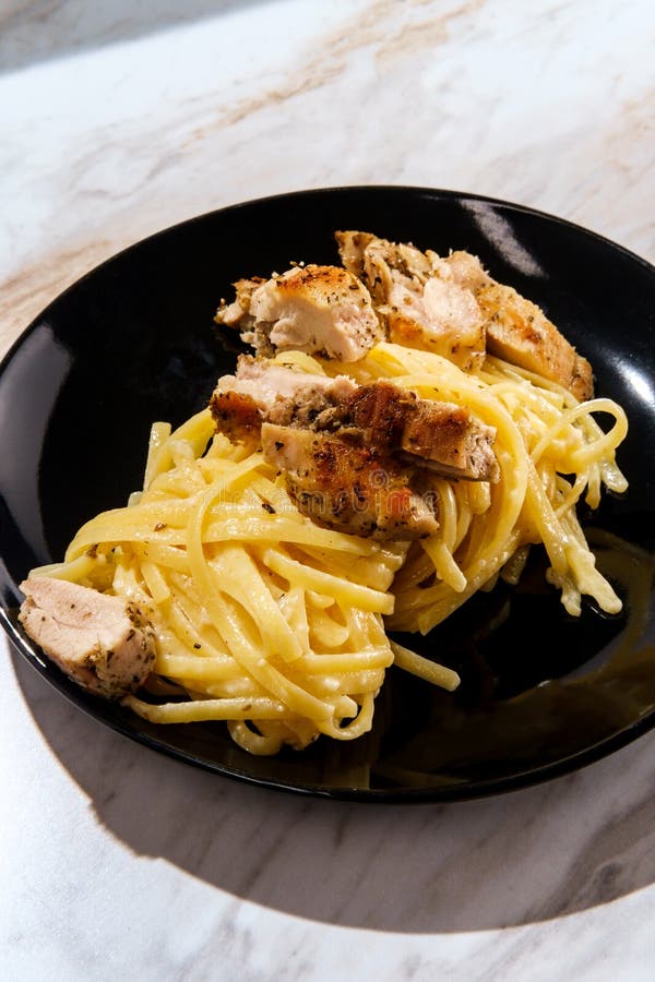 Italian Fettuccine Chicken Alfredo Stock Photo - Image of butter ...