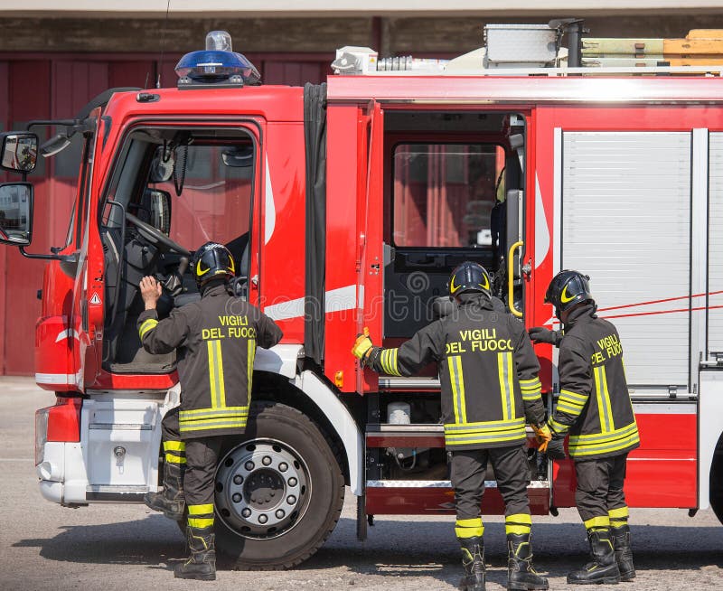 Italian Firefighters Climb on Firetrucks during an Emergency Stock ...