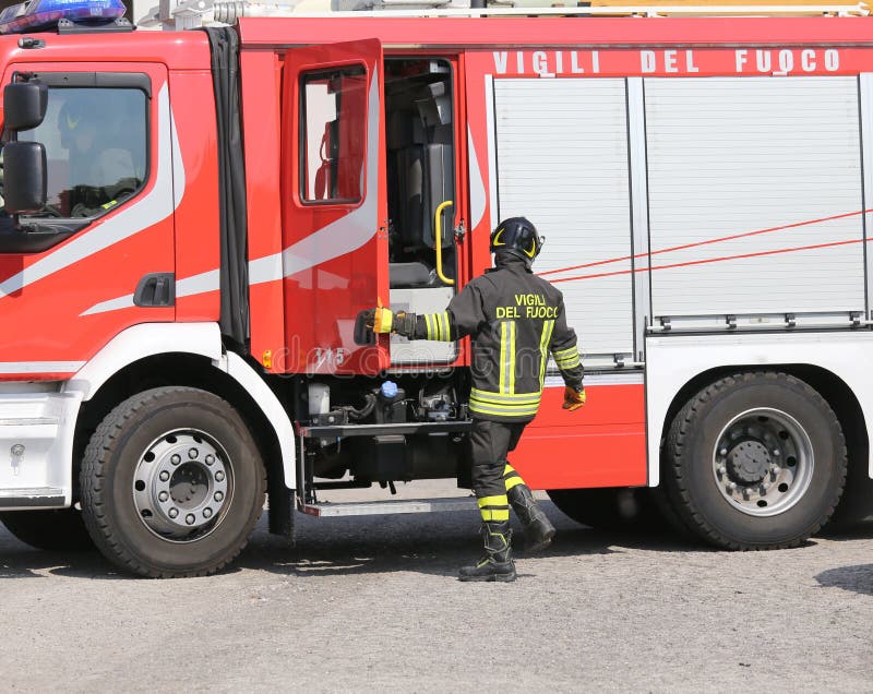 Italian Firefighters during an Emergency with Protective Suits a Stock ...