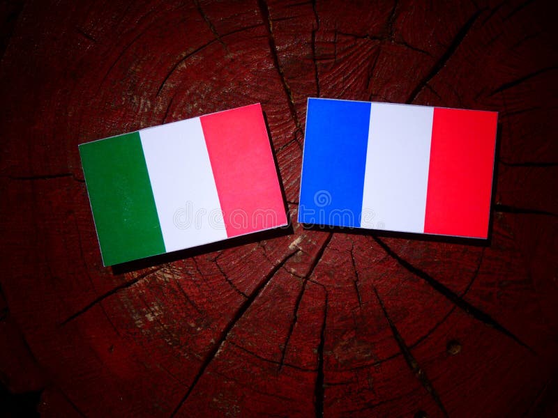 Italian Flag with French Flag on a Tree Stump Isolated Stock Image ...