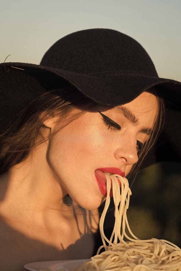 Italian Food Woman Eating Spaghetti With Wouth In The White Plate