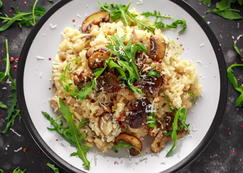 Italian Mushroom Risotto with Parmesan Cheese and Wild Rocket on Top ...