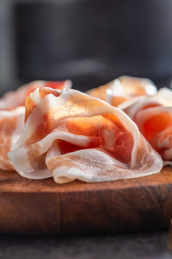 Italian Panchetta. Sliced Smoked Bacon on Cutting Board Stock Photo ...