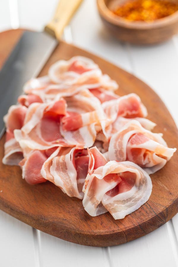 Italian Panchetta. Sliced Smoked Bacon on Cutting Board Stock Photo ...