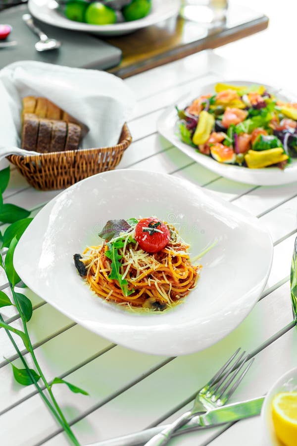 Italian Pasta with Cheese and Vegetables on a White Plate Stock Photo ...