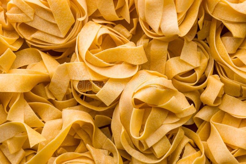 Italian Pasta Tagliatelle. Uncooked Noodle Pasta Stock Image - Image of ...