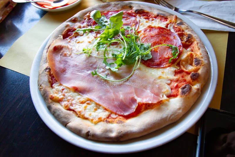 Italian pizza dish stock photo. Image of food, table - 240376806